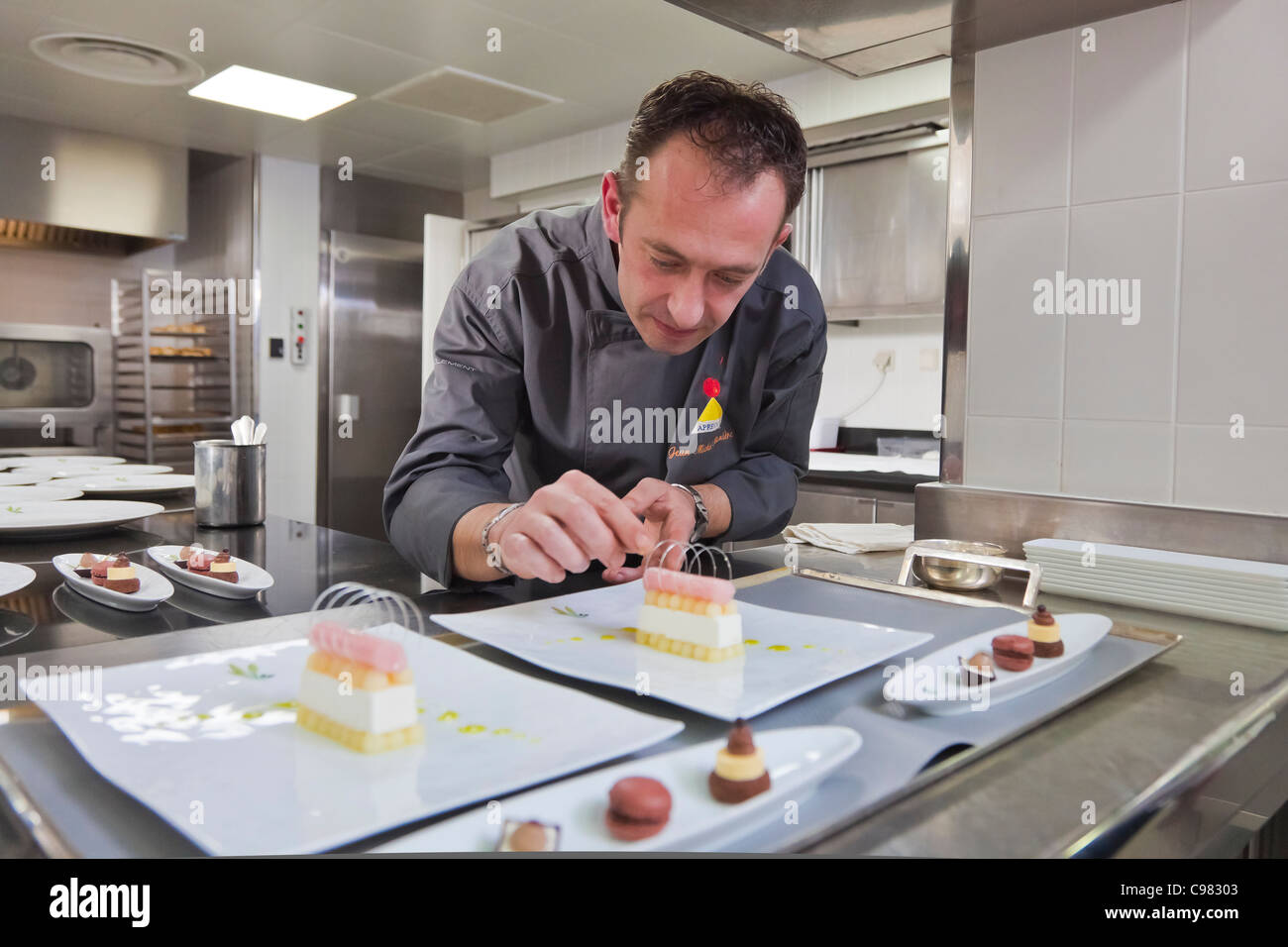 The head-pastry chef making and garnishing some desserts., CHATEAU ...