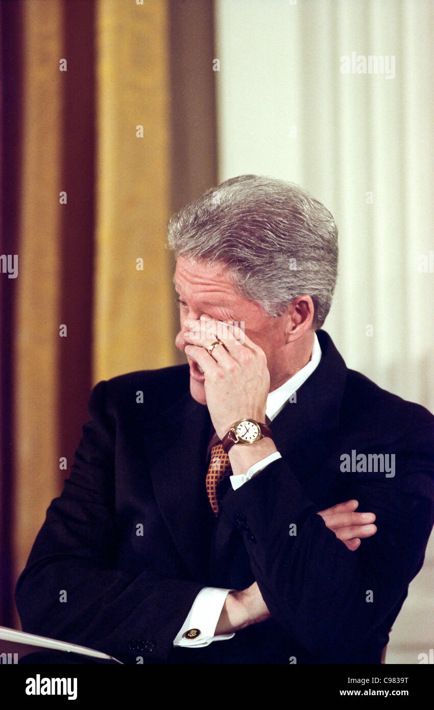US President Bill Clinton laughs during a White House event February 17 ...