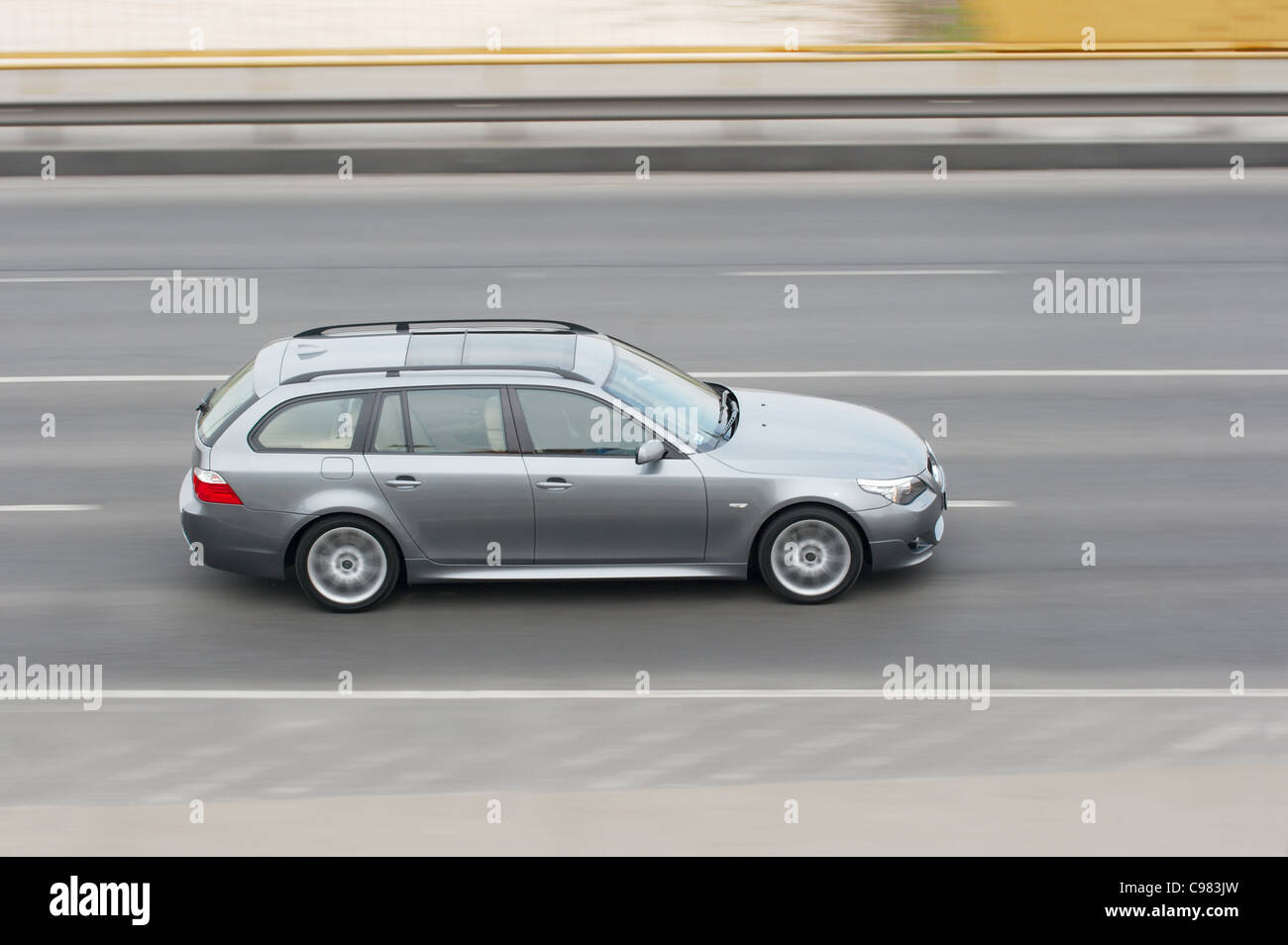 Car going fast with motion blur Stock Photo - Alamy