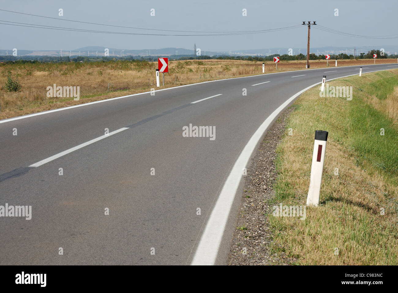 Road bending in a rural area Stock Photo - Alamy