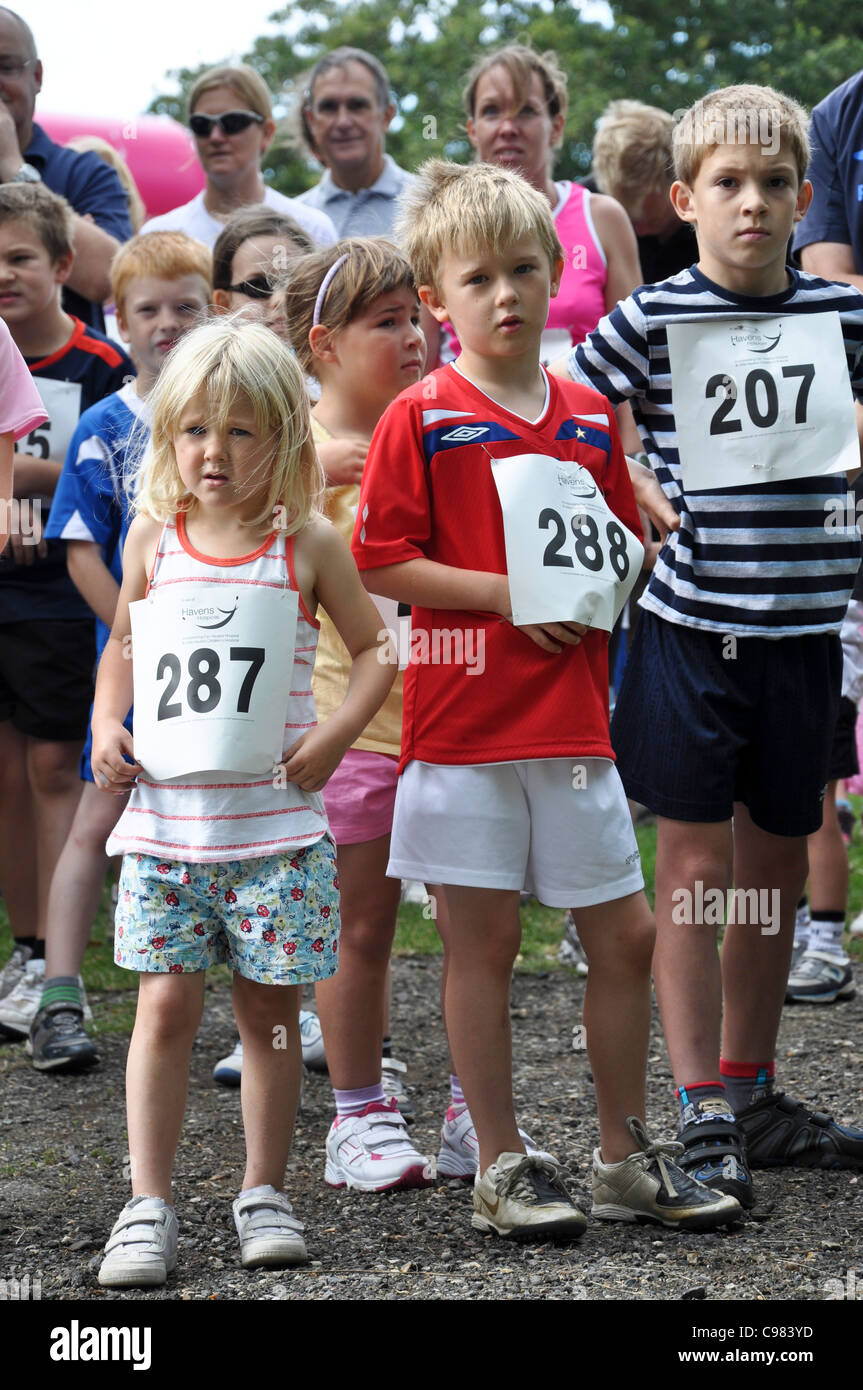 Children getting ready for a running race Stock Photo - Alamy