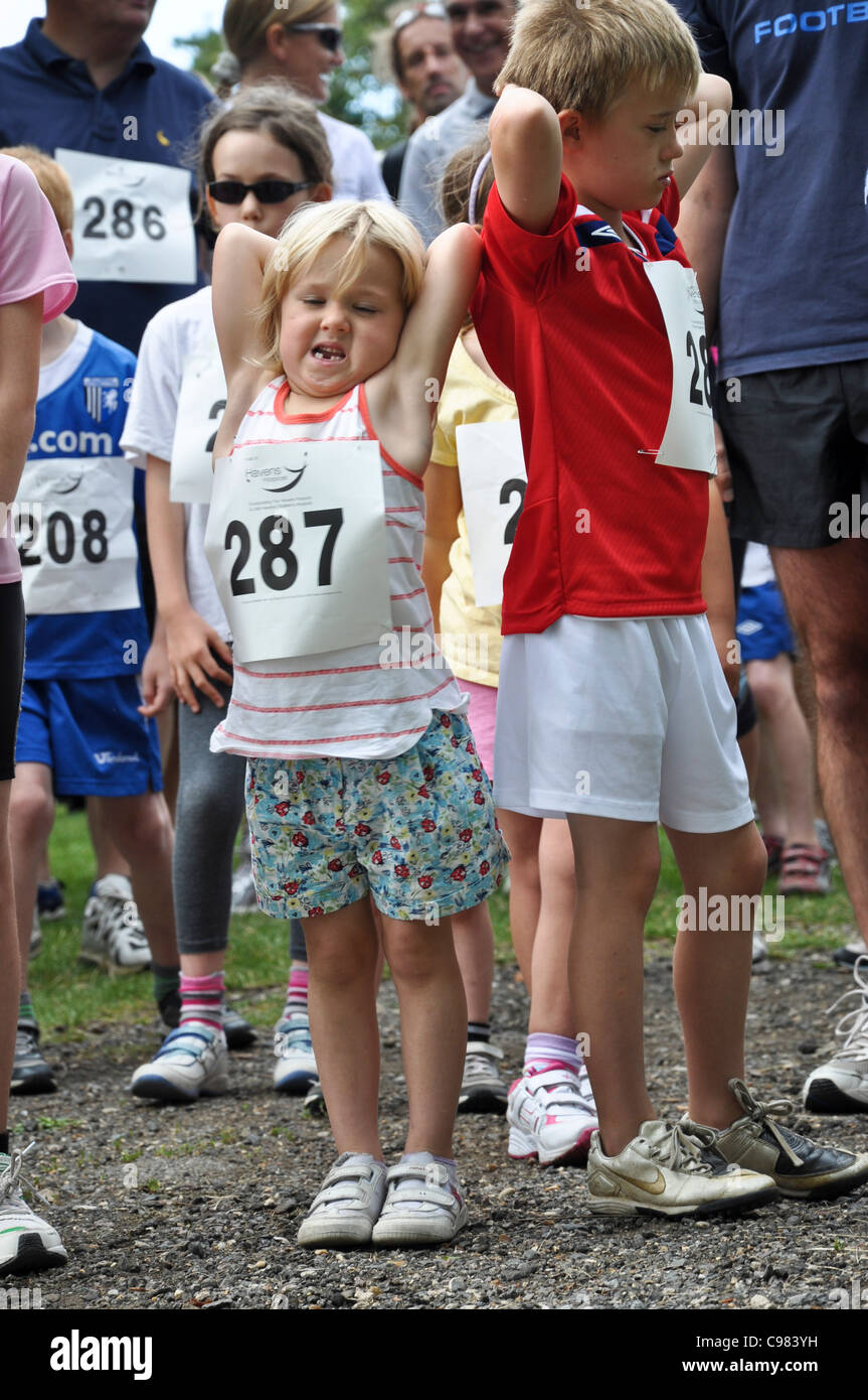 Children getting ready for a running race Stock Photo - Alamy