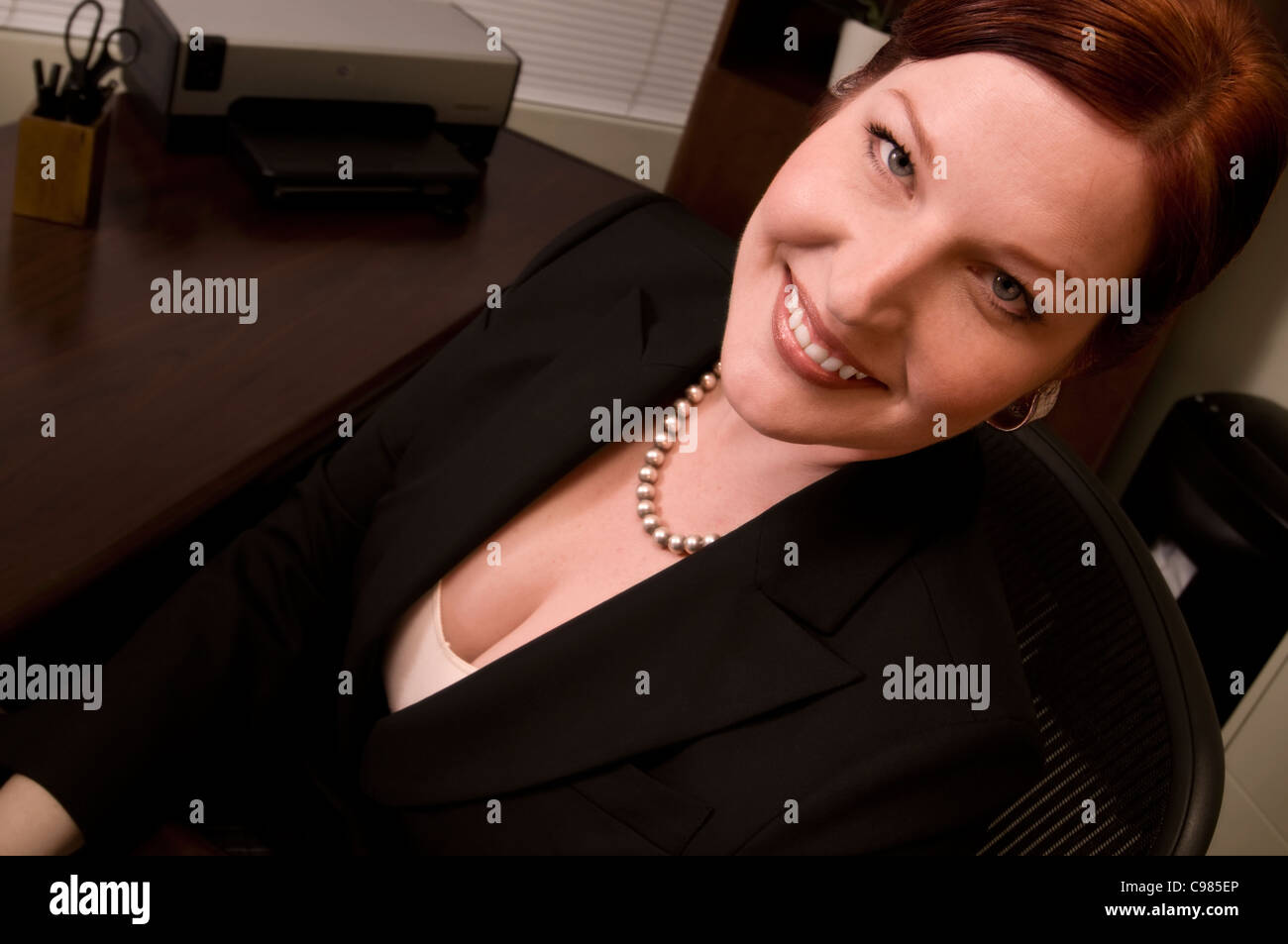 Portrait of corporate executive at her desk Stock Photo - Alamy