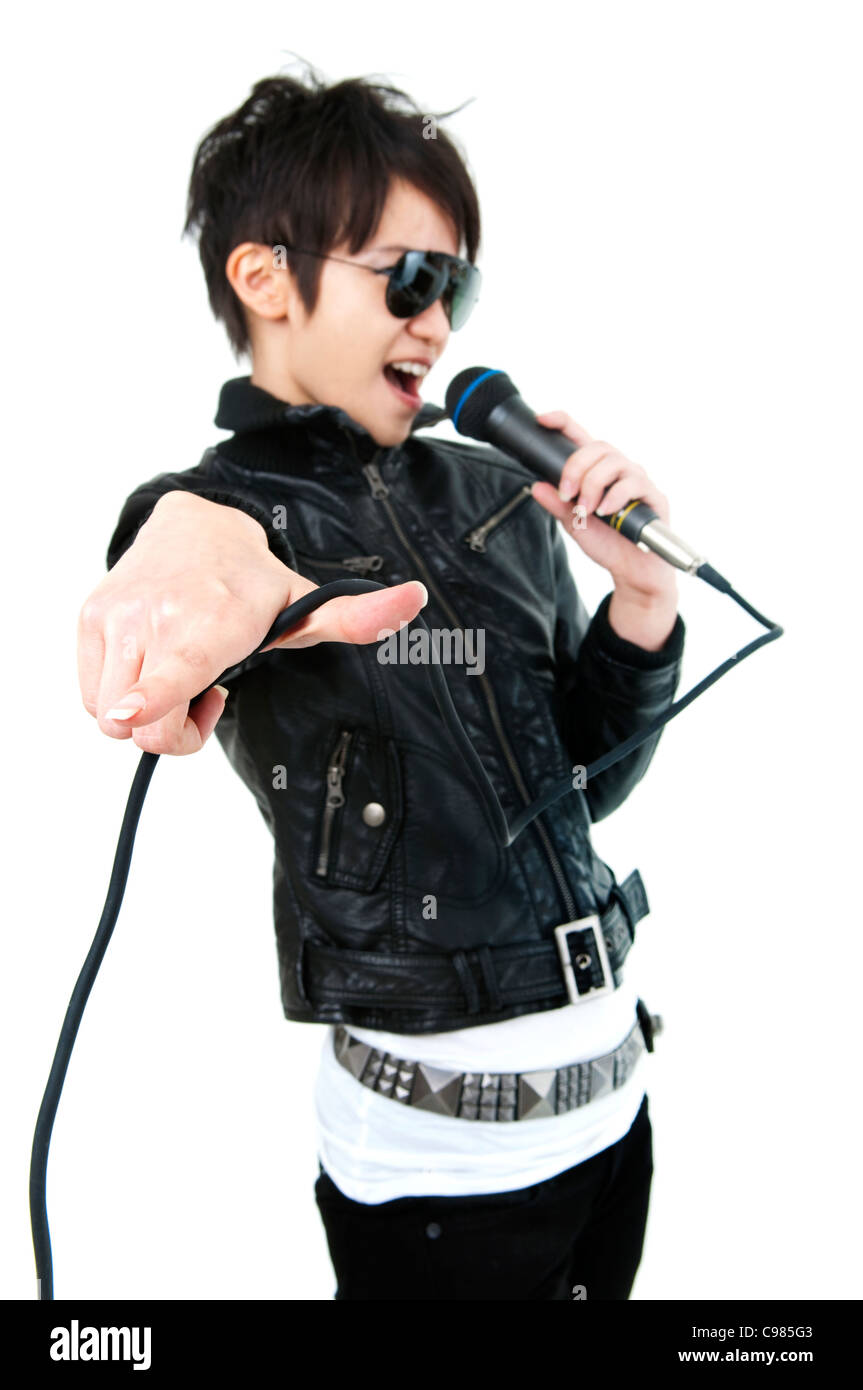 Asian rock singer in performance, isolated on white, focus on fingers ...