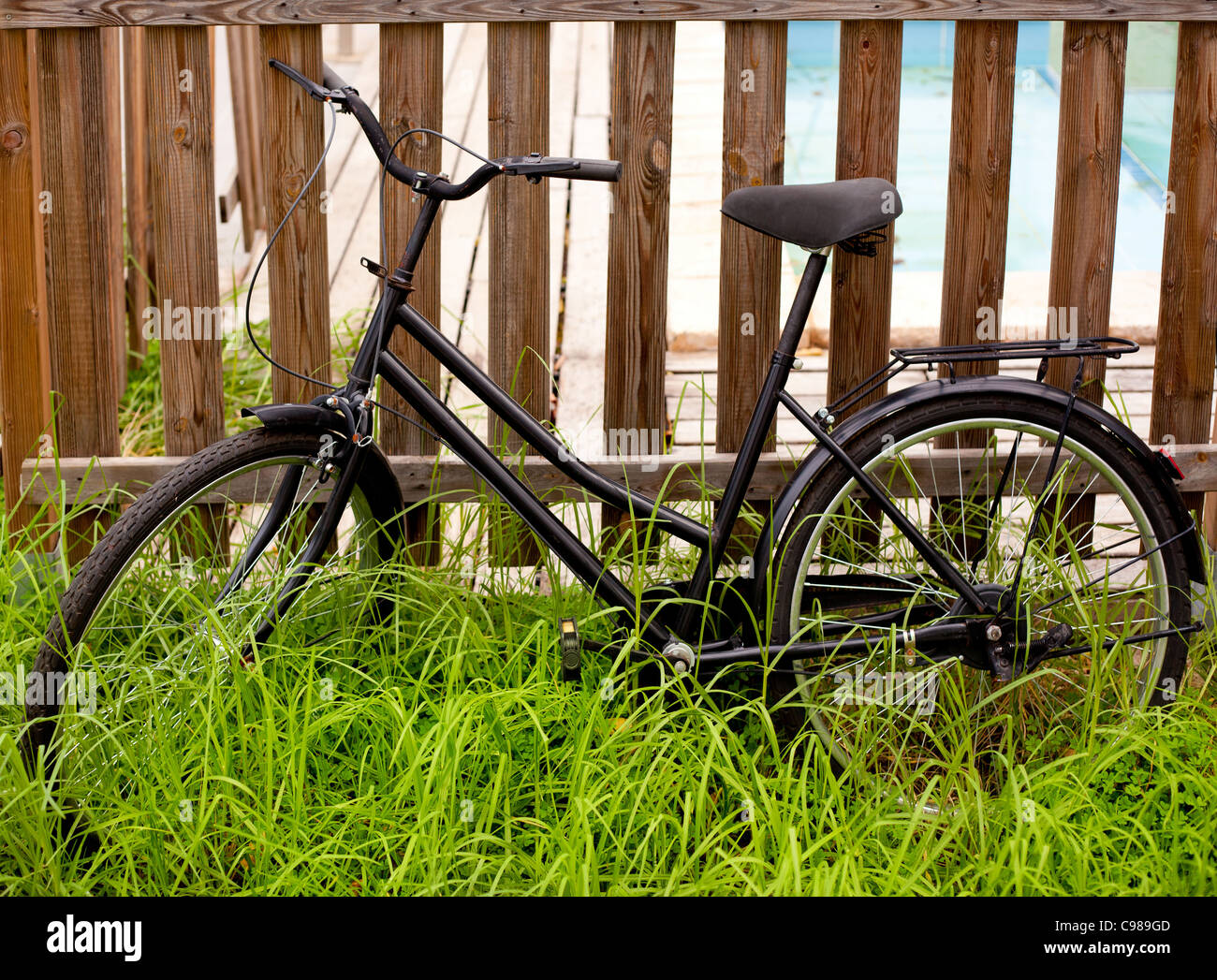 vintage bicycle in fence Stock Photo - Alamy