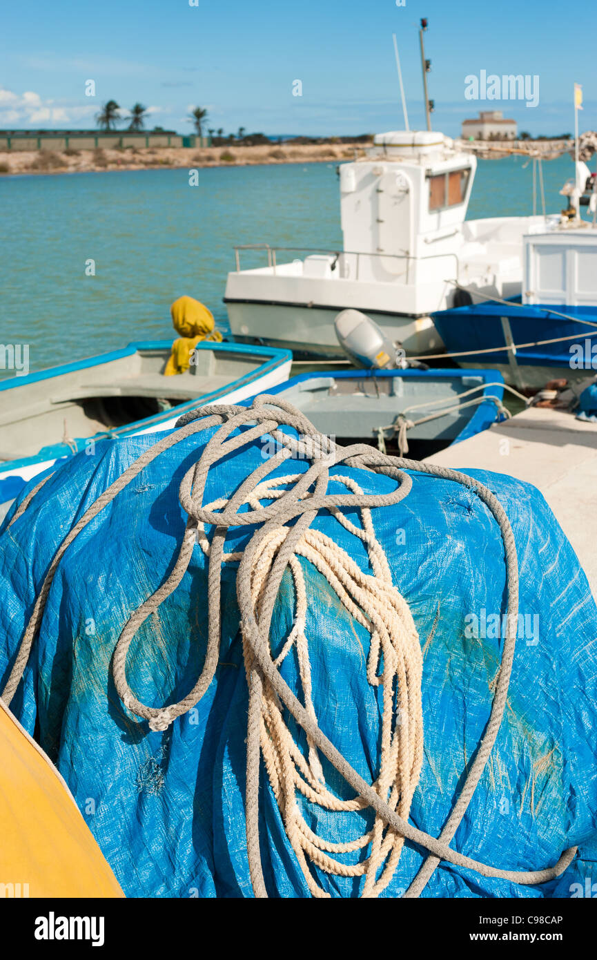 Fishing tackle and traditional small trawlers at a Mediterranean harbor ...