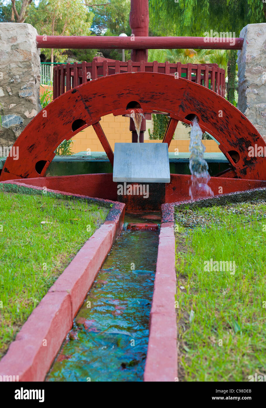 Traditional old water mill rotating with flowing water Stock Photo - Alamy