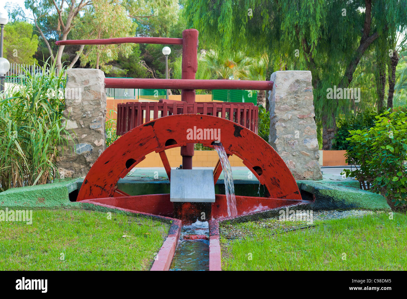 Traditional old water mill rotating with flowing water Stock Photo - Alamy