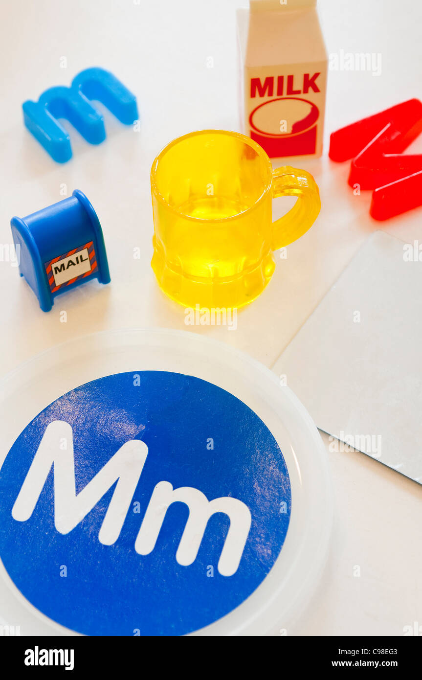 Plastic container with letter m on lid Stock Photo - Alamy