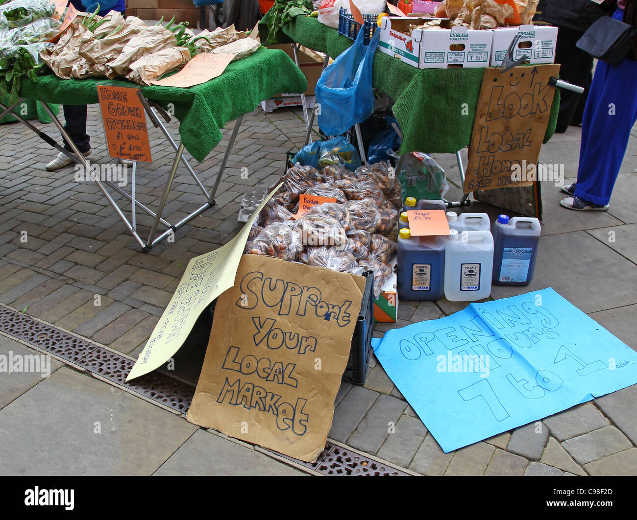 Hand written sign saying support your local market Stock Photo - Alamy