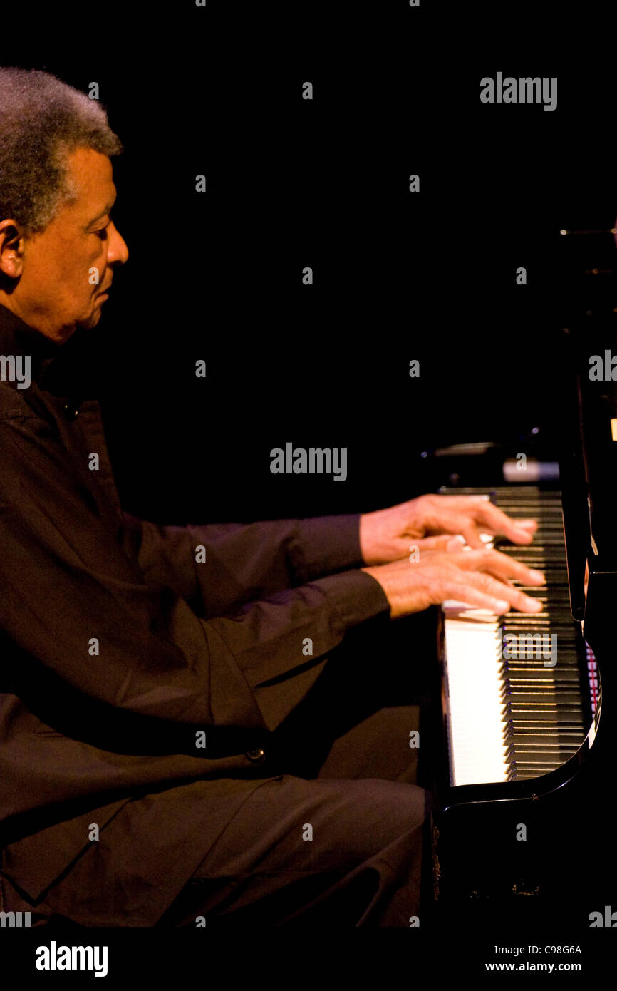 Abdullah Ibrahim playing the piano in concert at the Royal Northern ...