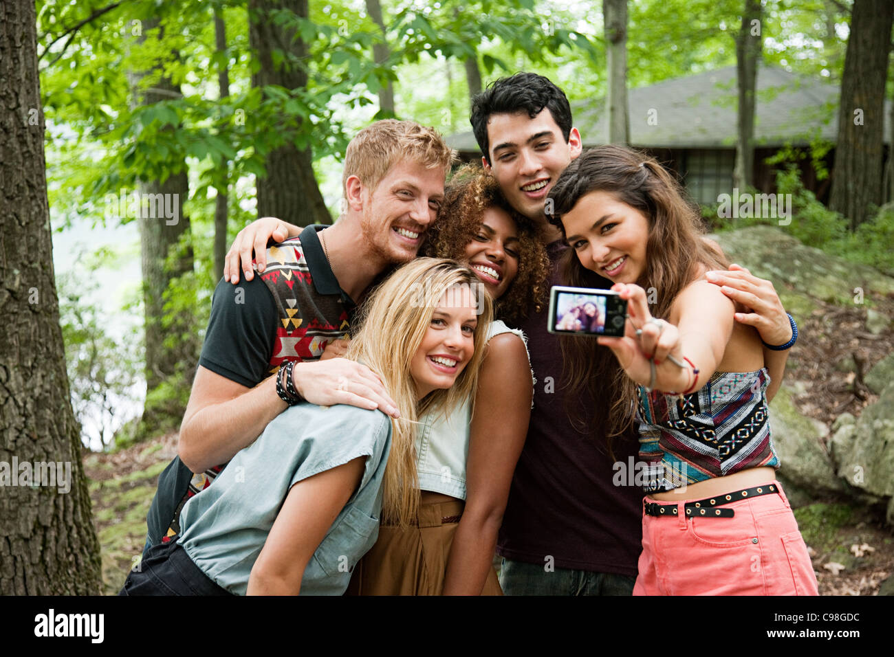 Friends posing front digital camera Stock Photo - Alamy