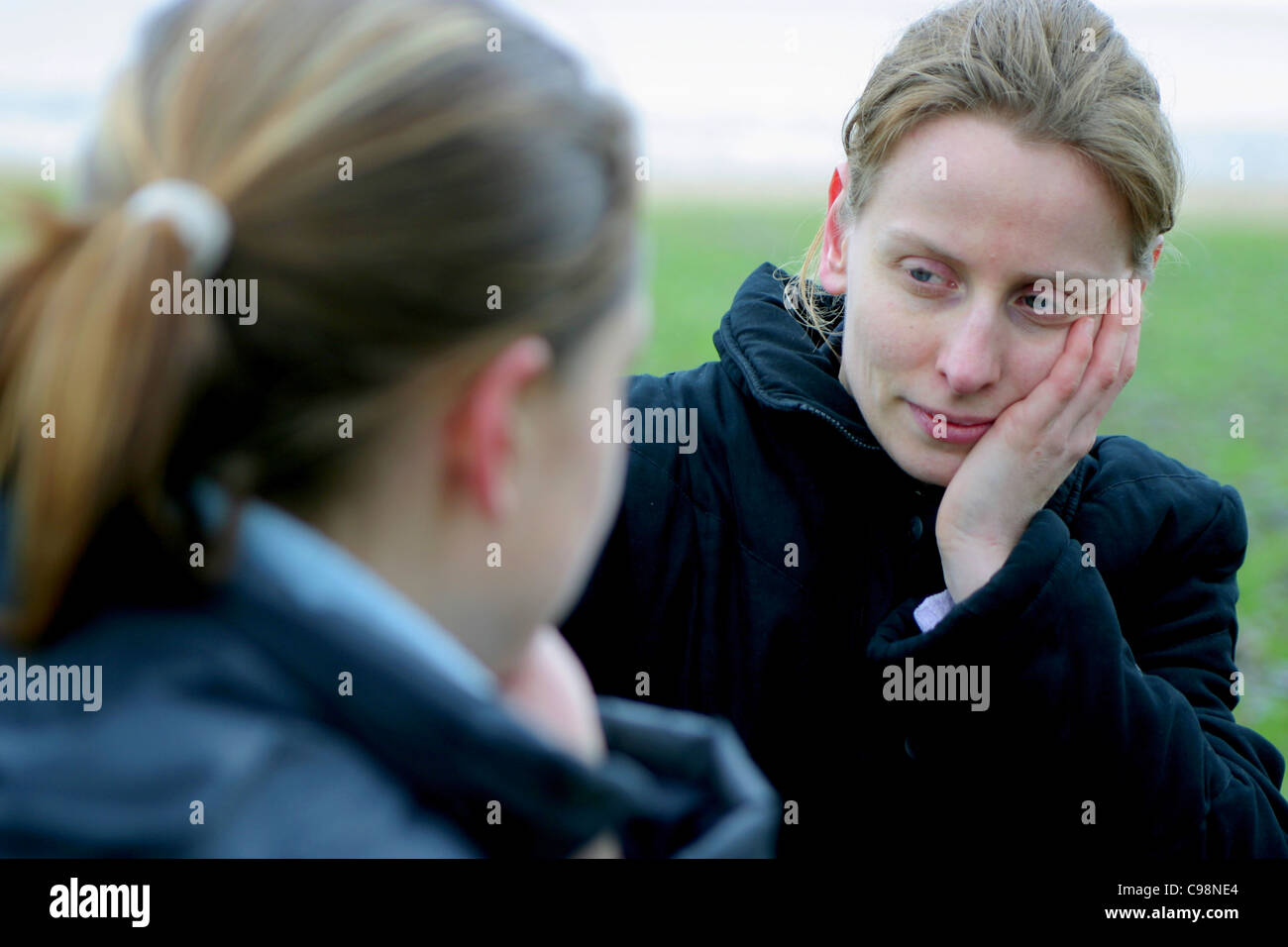 2 women talking sad hi-res stock photography and images - Alamy