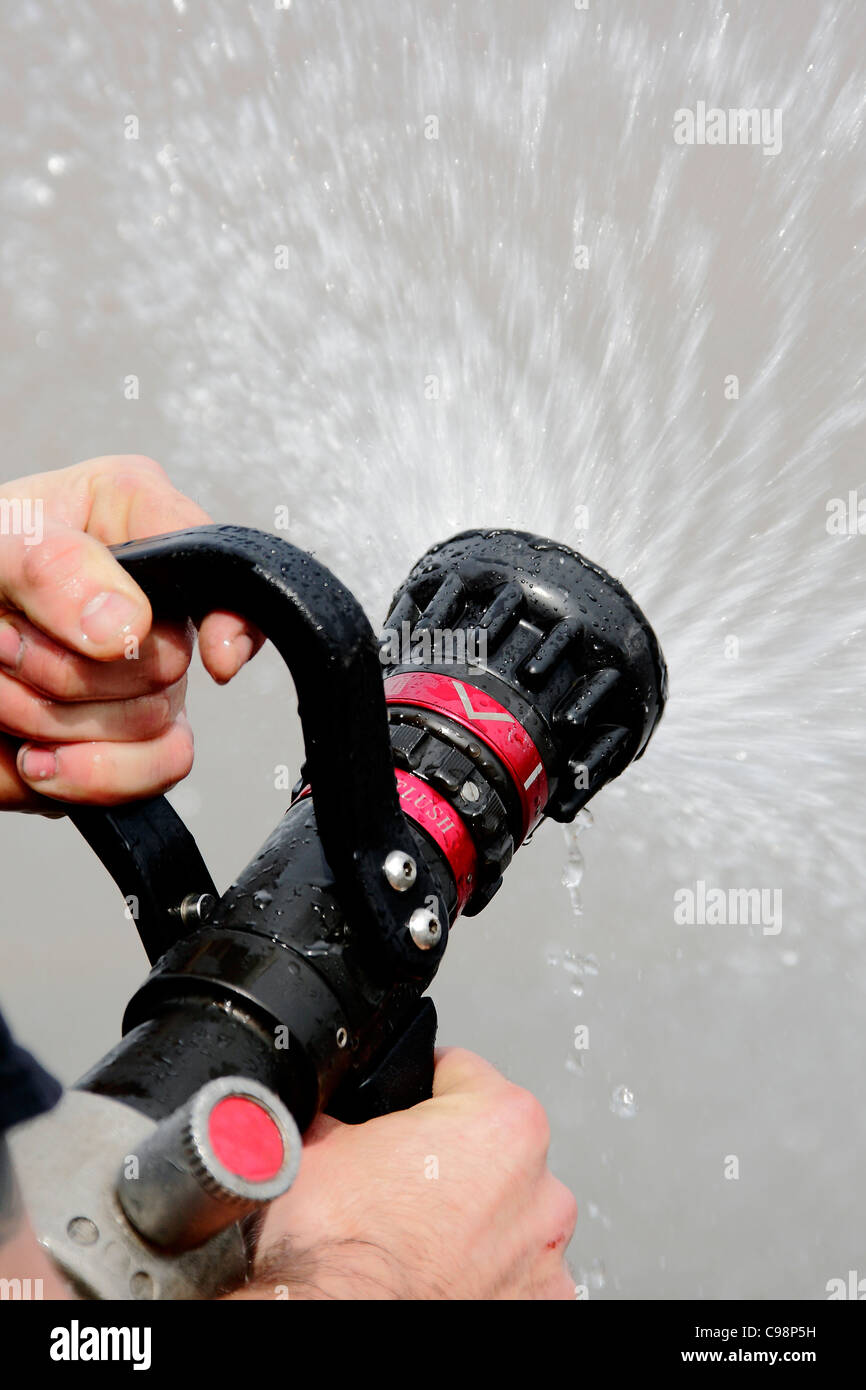 Spray pattern from a fire hose Stock Photo - Alamy