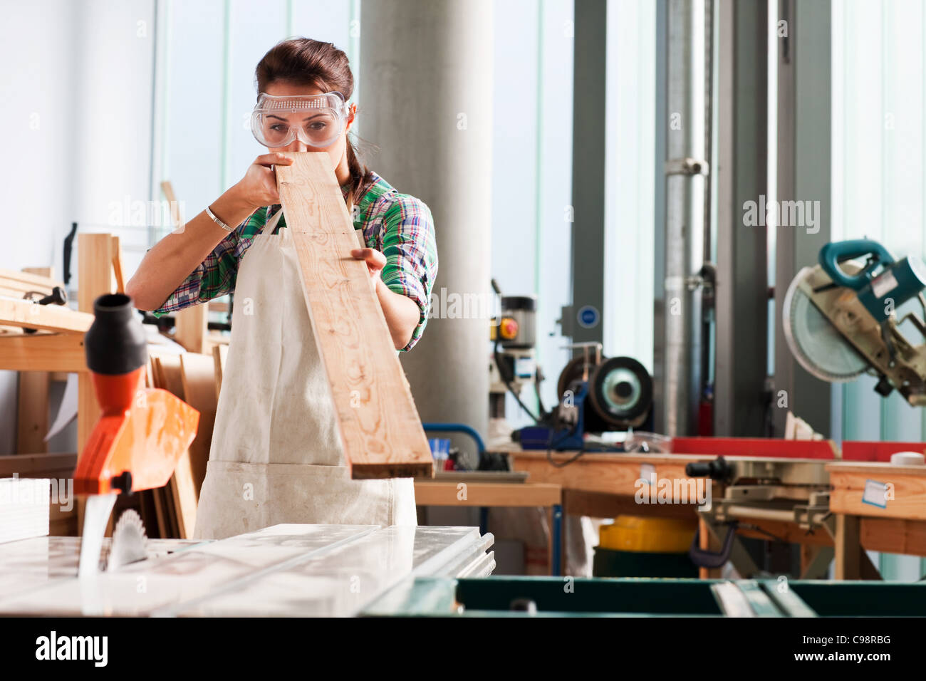 Carpenter checking angle wood workshop Stock Photo - Alamy