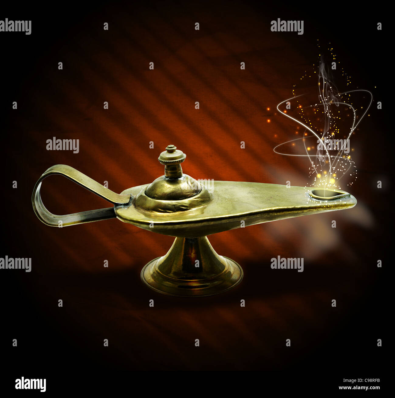 magic aladin lamp with magic smoke and sparkles on a brown background ...