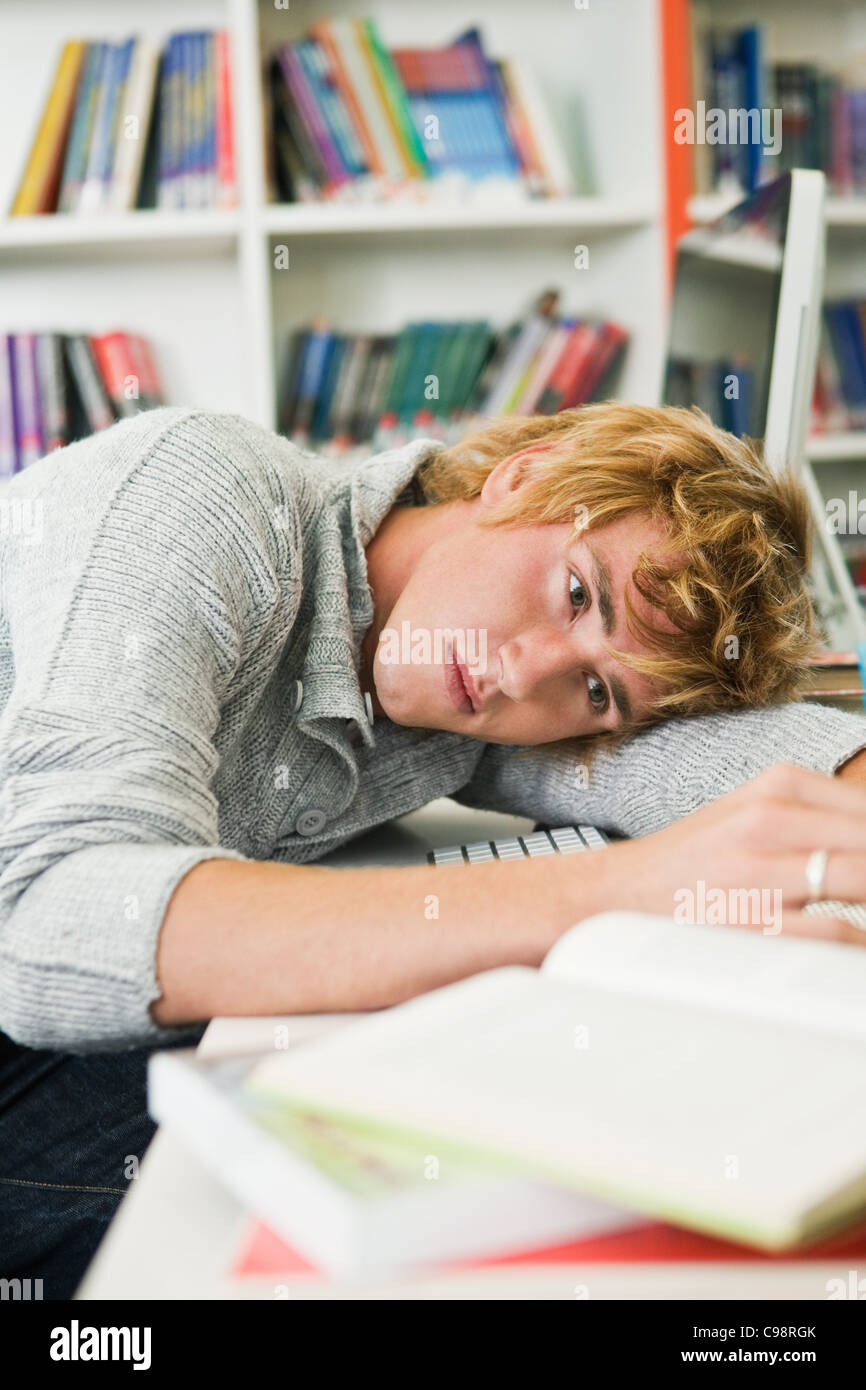 University student daydreaming desk Stock Photo - Alamy