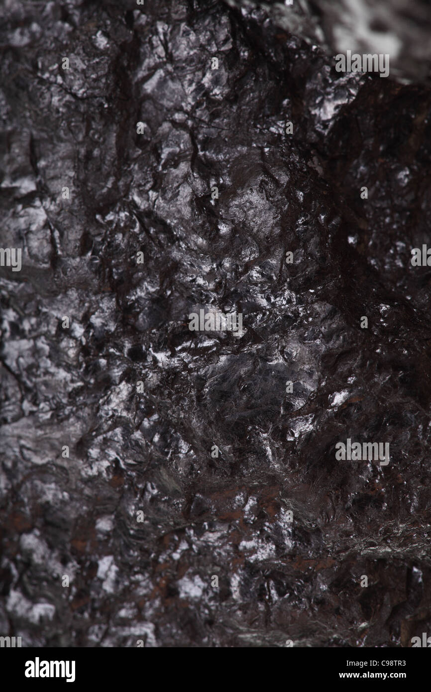 Pieces of black fossil coal texture background Stock Photo - Alamy