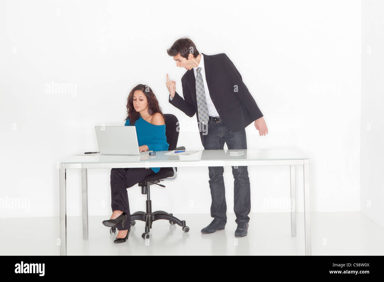 boy shouting to girl at the office Stock Photo - Alamy