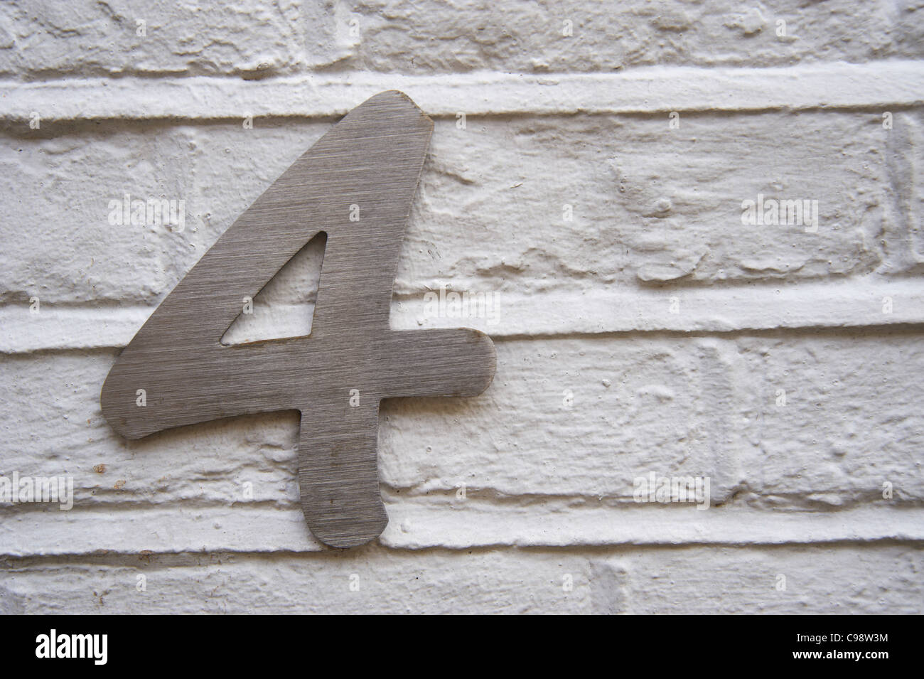 door house number 4 Stock Photo - Alamy