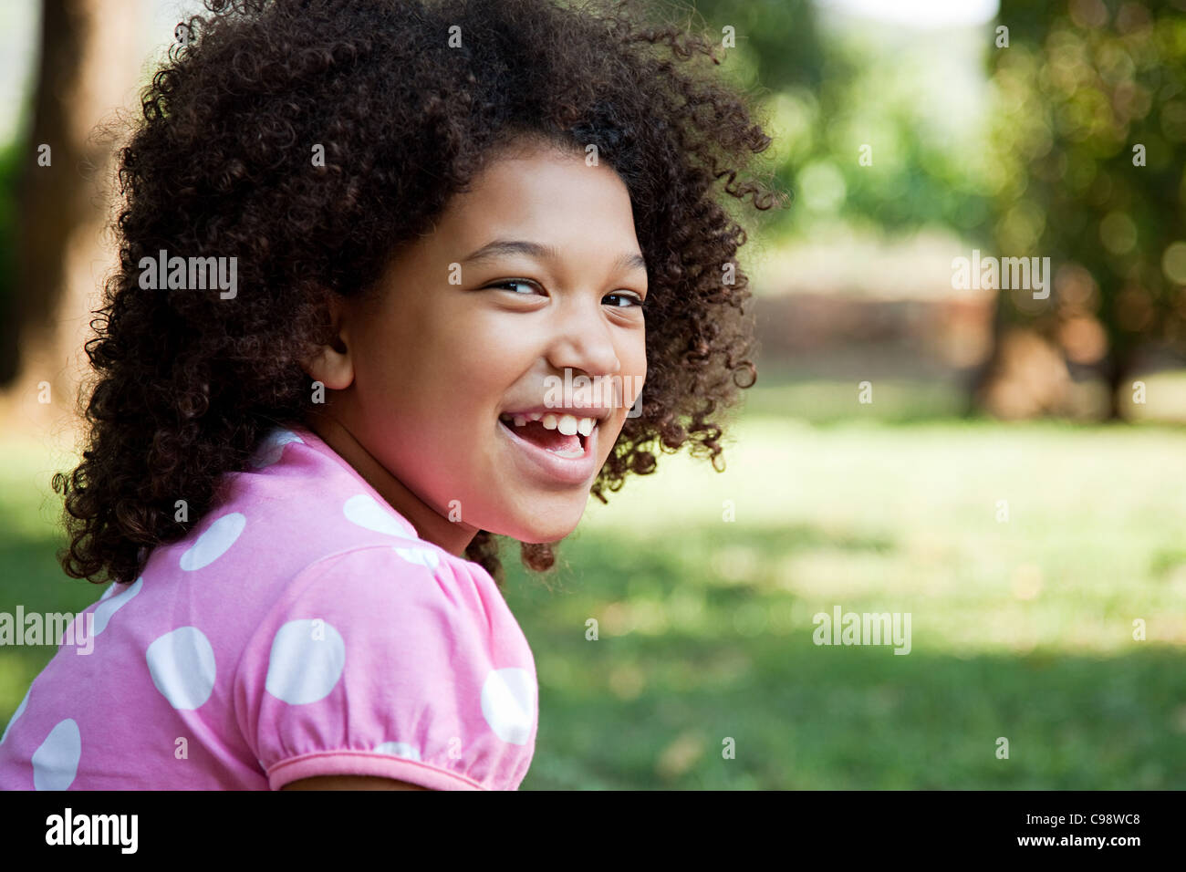 Young girl wearing pink spotty top, portrait Stock Photo - Alamy
