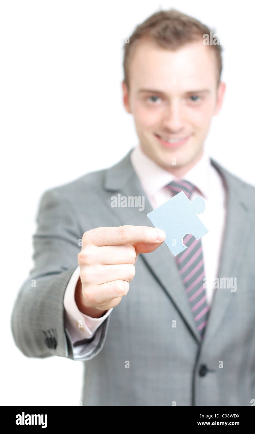 A business man solving a puzzle Stock Photo - Alamy