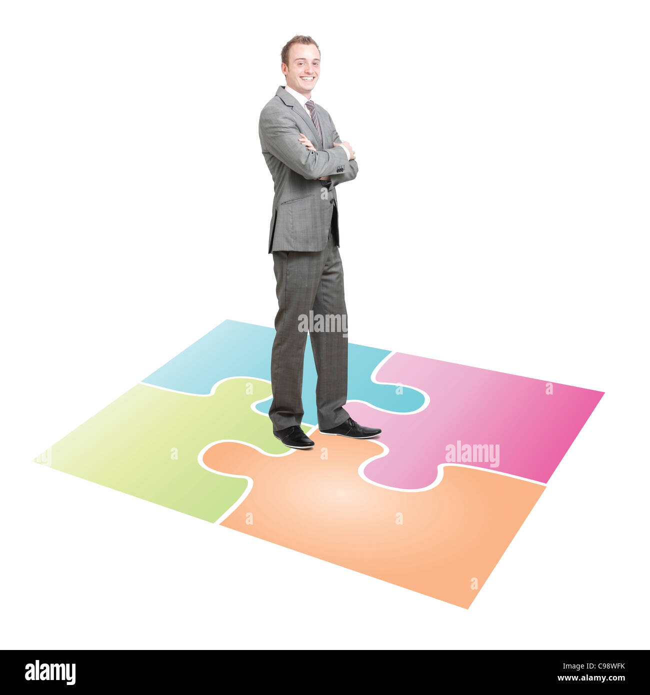 Businessman solving a puzzle Stock Photo - Alamy