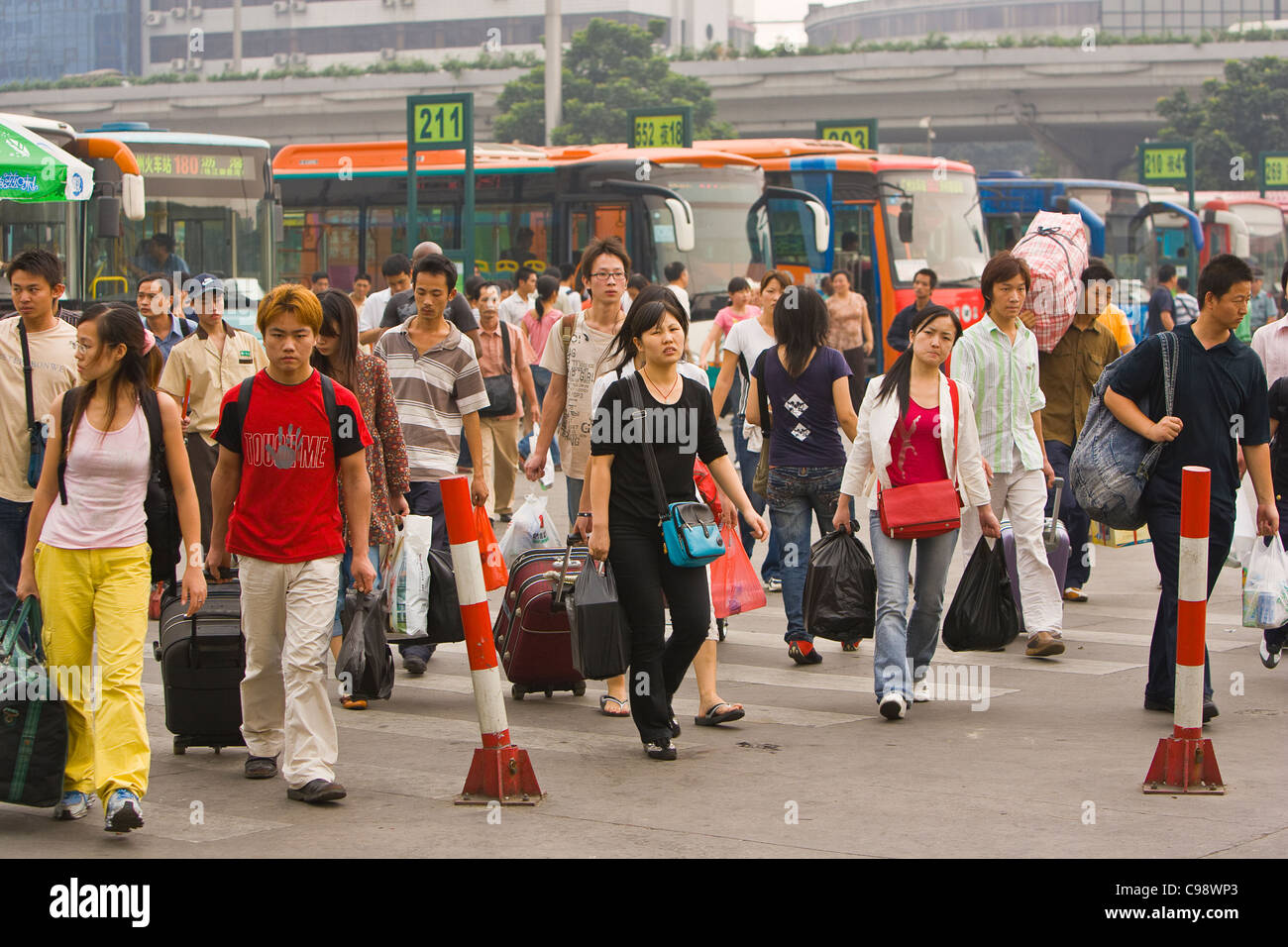 GUANGZHOU, GUANGDONG PROVINCE, CHINA - Crowd of passengers move from ...