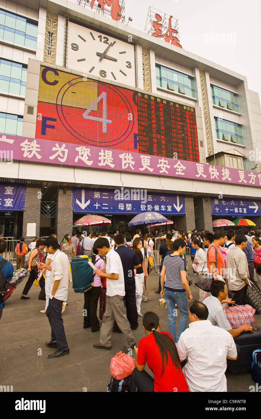 GUANGZHOU, GUANGDONG PROVINCE, CHINA - Passengers in front of train ...