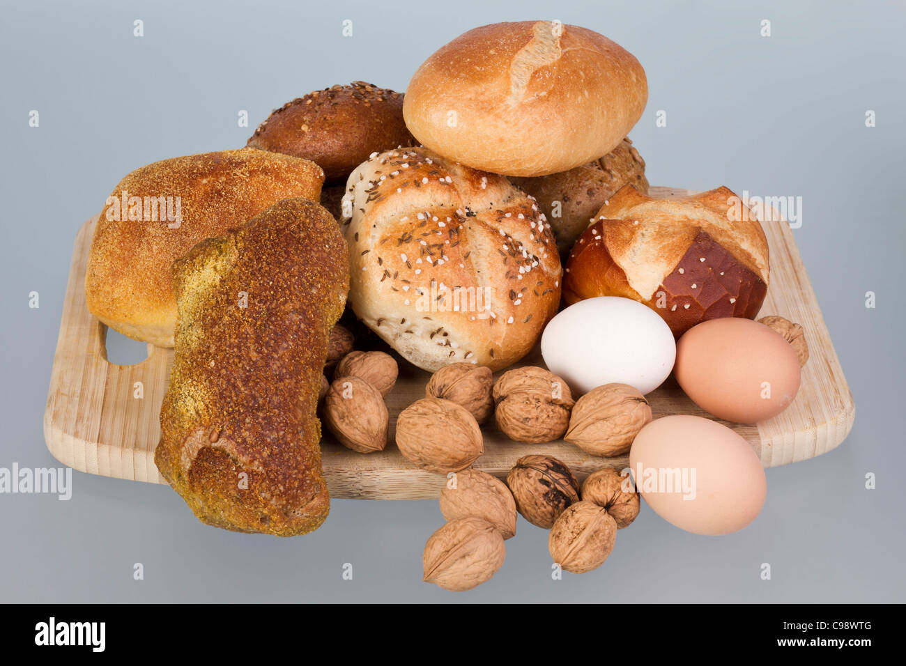 gem, nuts and eggs on a wooden board. neutral background Stock Photo ...