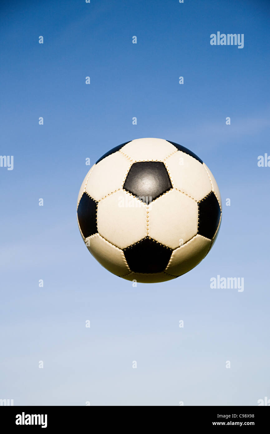 Football mid air Stock Photo - Alamy