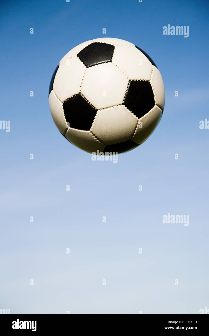 Football mid air Stock Photo - Alamy