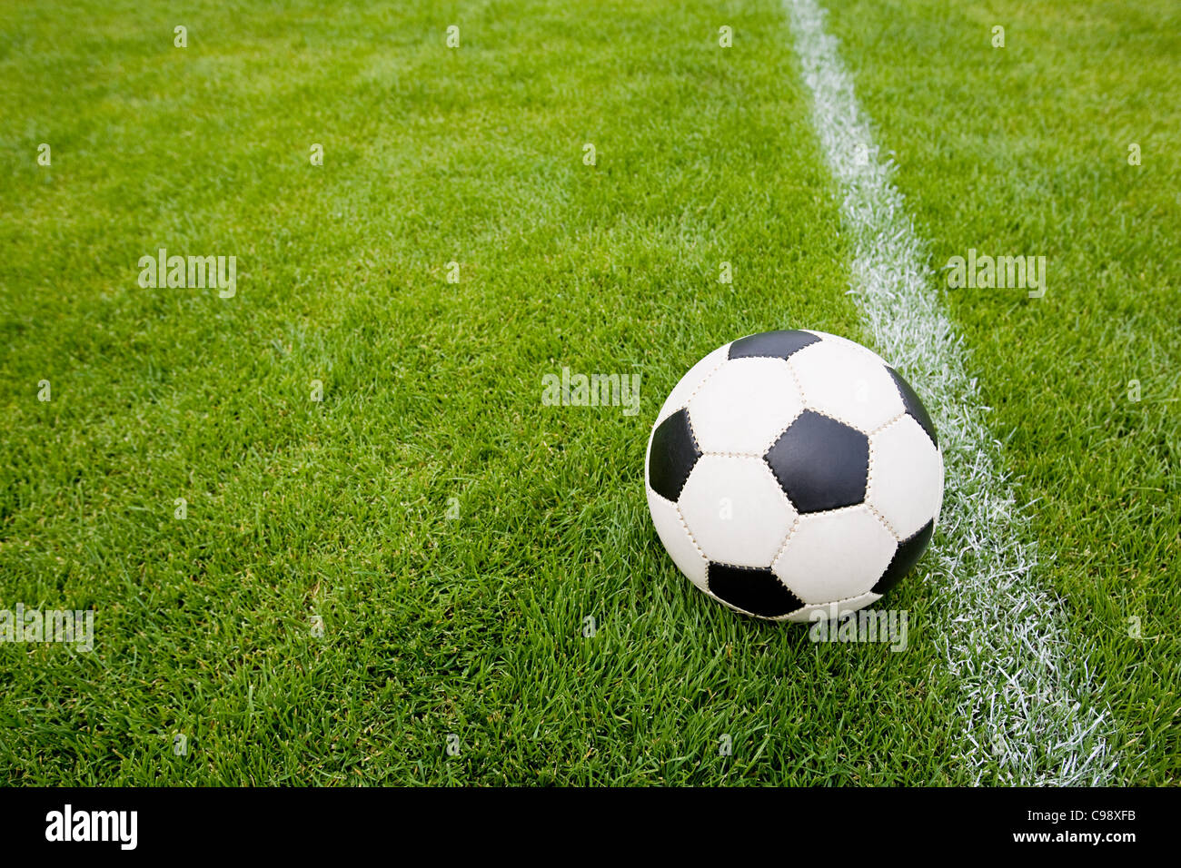 Football on pitch Stock Photo - Alamy