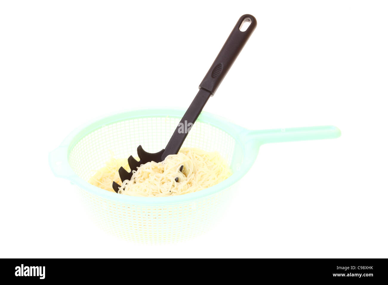 noodles in green colander isolated on a white background Stock Photo ...