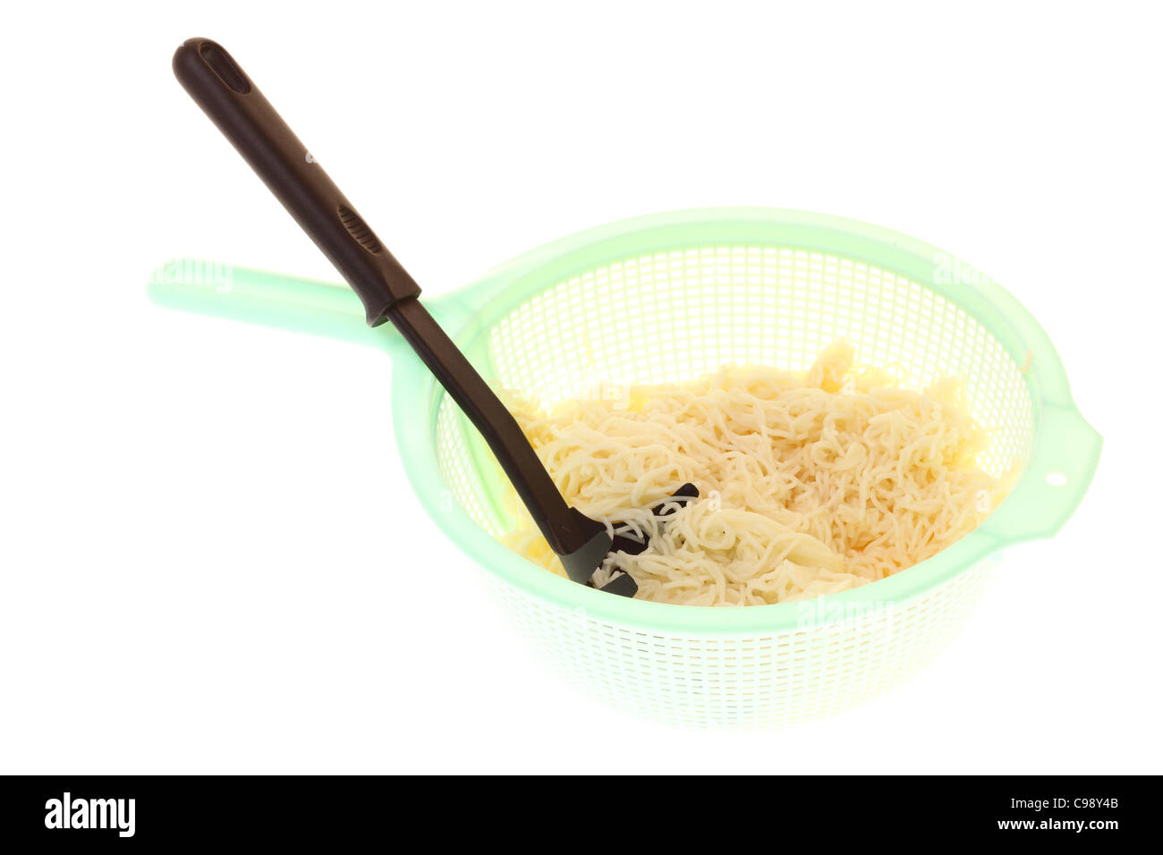 noodles in green colander isolated on a white background Stock Photo ...