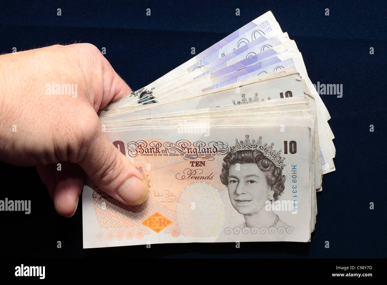 Fan of ten pound notes with hand hi-res stock photography and images ...