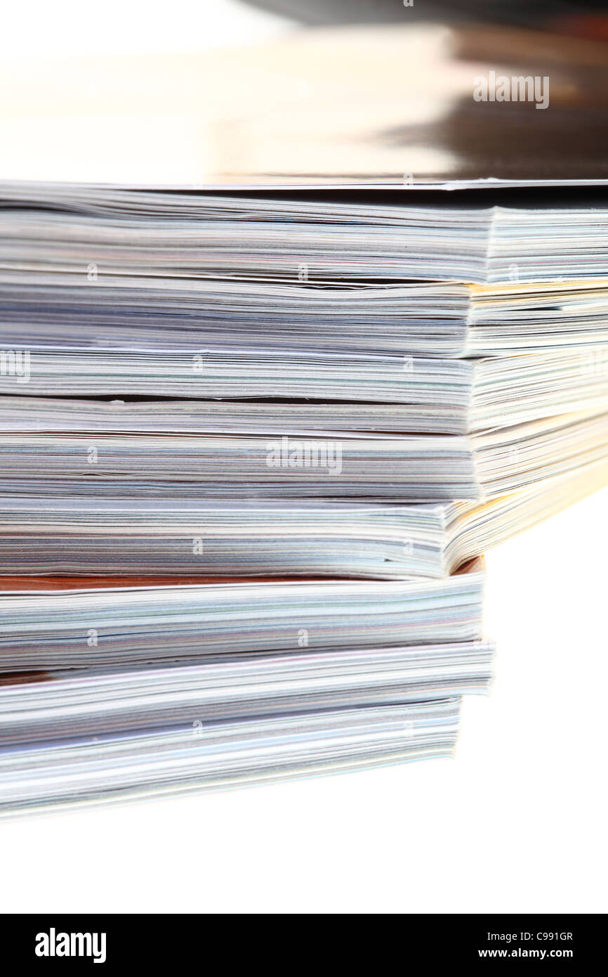 stack of magazines isolated over white background Stock Photo - Alamy