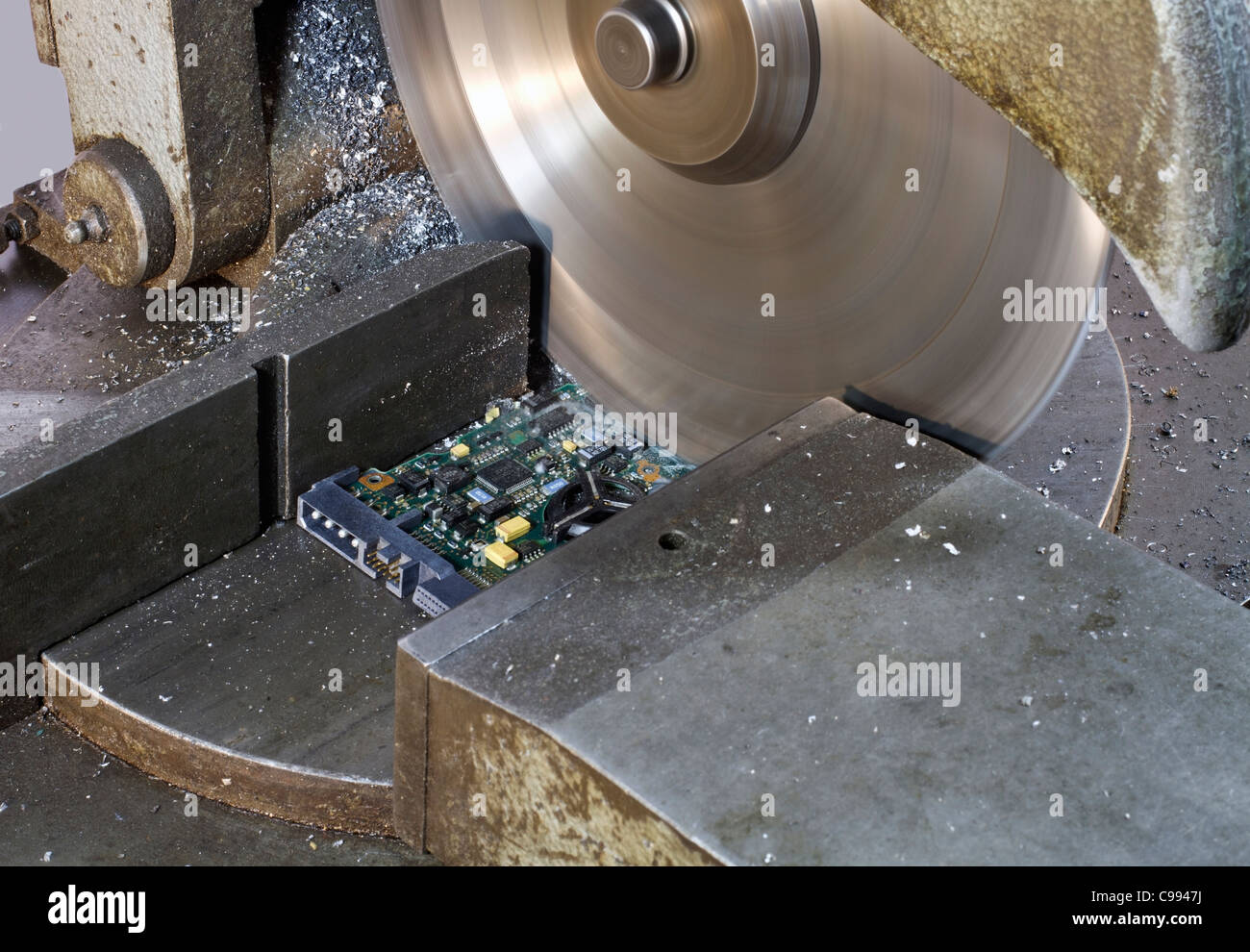 detail of a rotating circular saw while cutting a circuit board Stock ...
