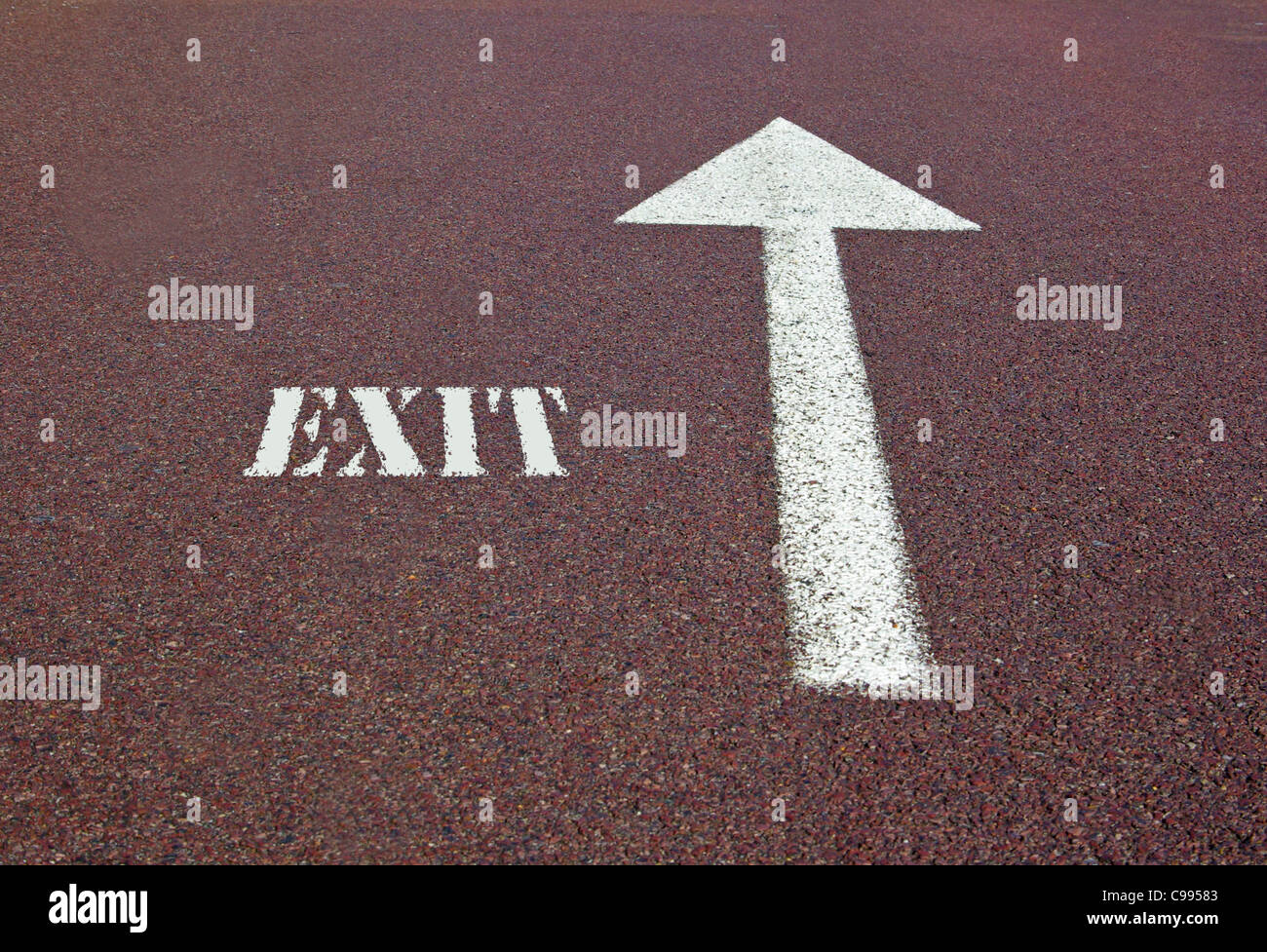 an arrow on the asphalt showing the exit direction Stock Photo - Alamy