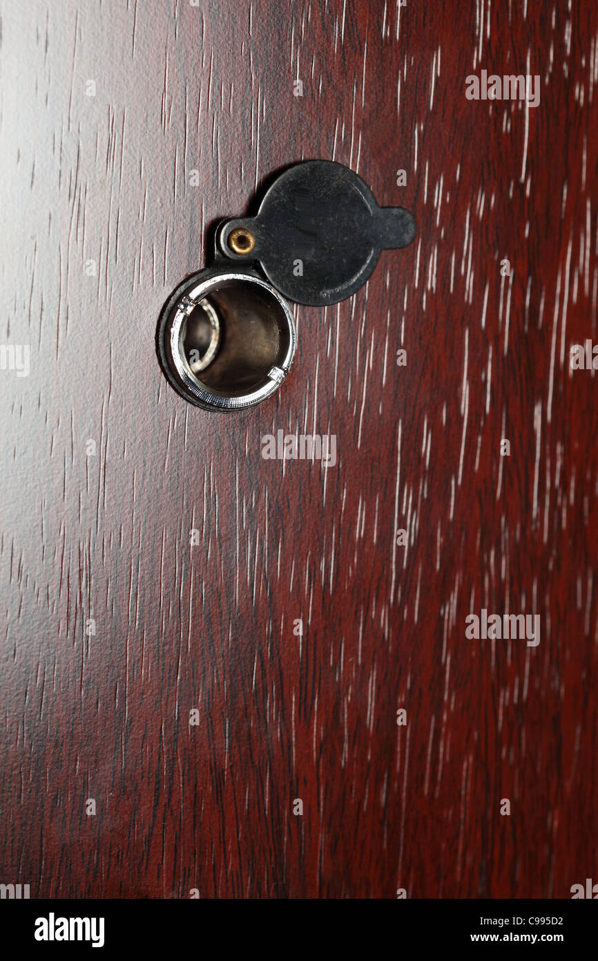 Peephole on wooden door - judas hole spyhole Stock Photo - Alamy
