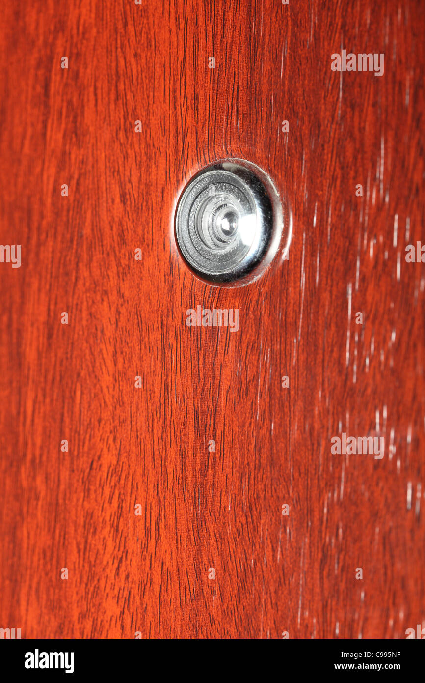 Peephole on wooden door - judas hole spyhole Stock Photo - Alamy