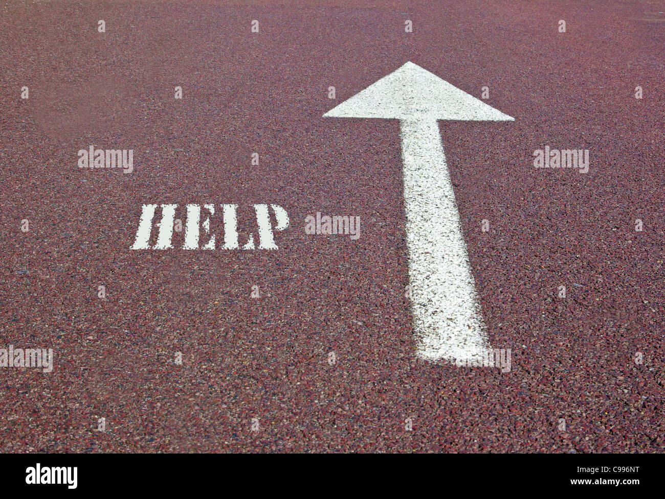 an arrow on the asphalt showing the direction fot getting help Stock ...