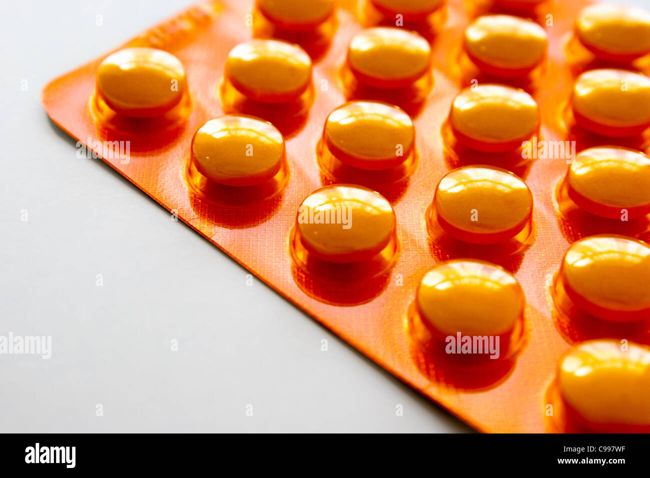 A blister pack of pills isolated on white Stock Photo - Alamy