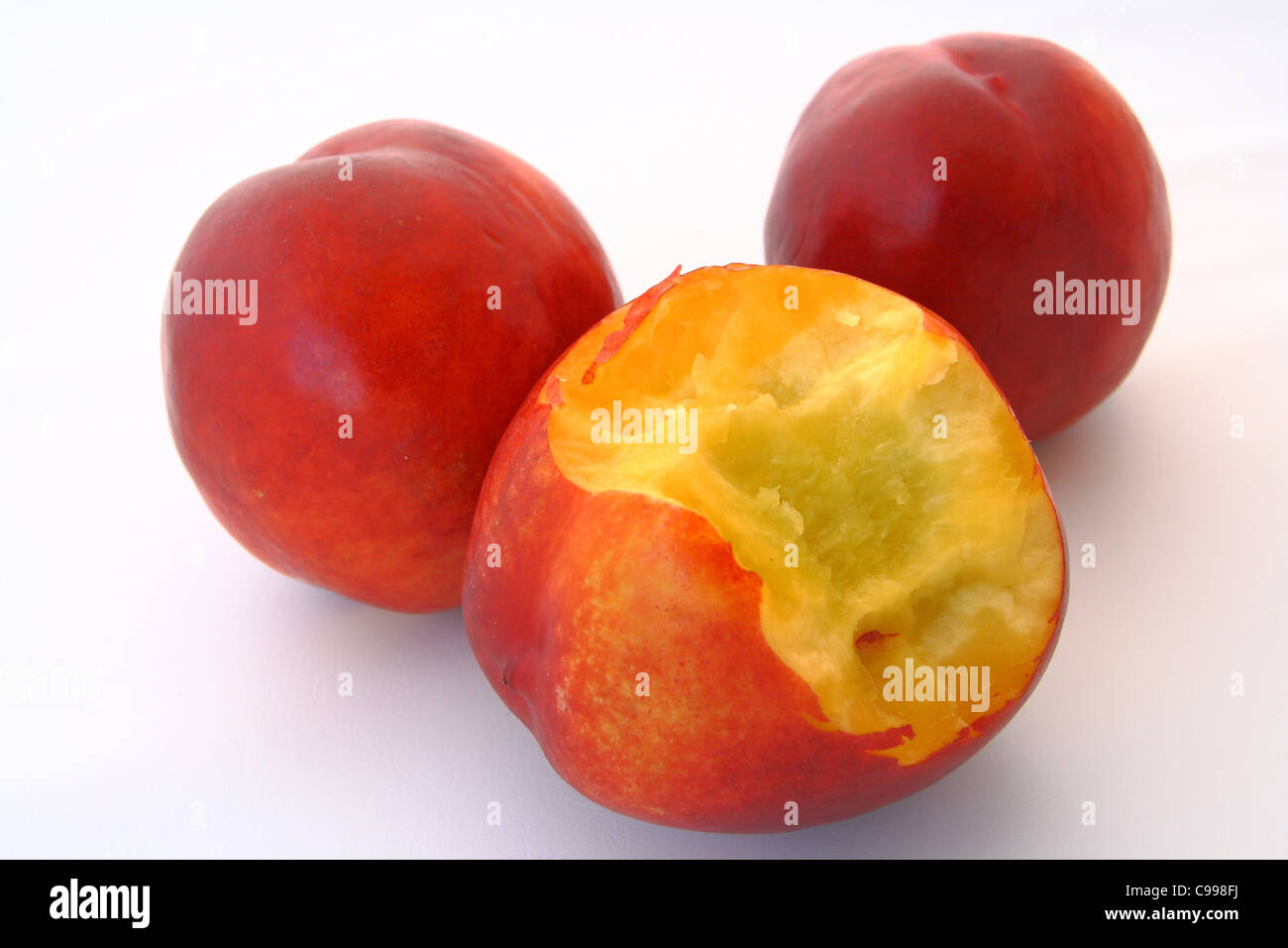 nectarines on the white background Stock Photo - Alamy
