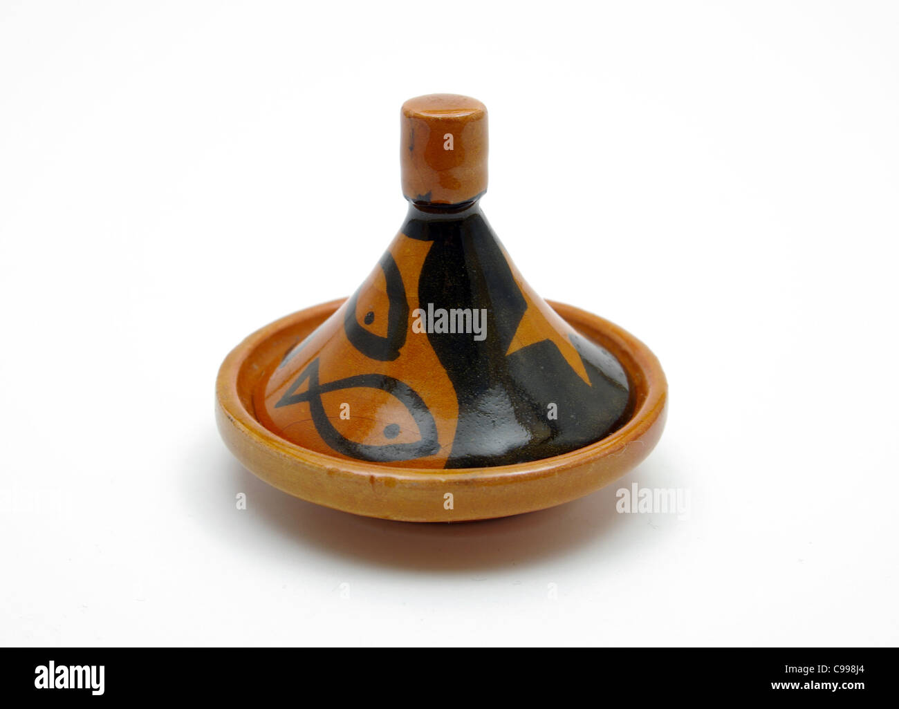 A moroccan handmade ceramic Tajine isolated on a white background Stock ...