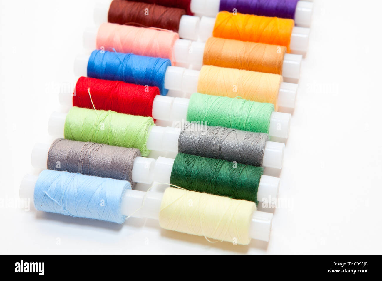 Colourful arranged reel of thread isolated on a white background Stock ...