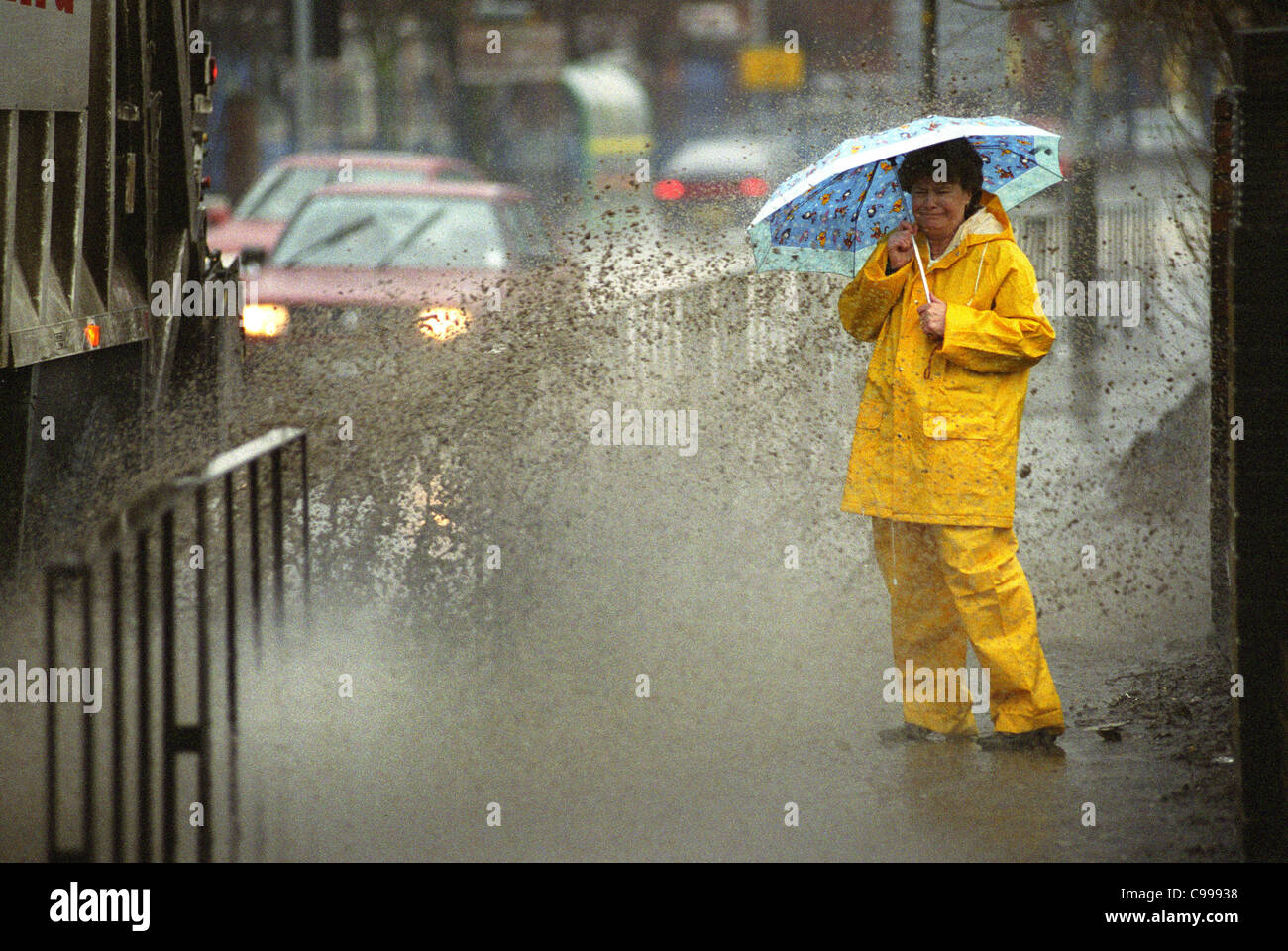 Pedestrian getting splashed sprayed by truck going through puddle Uk ...