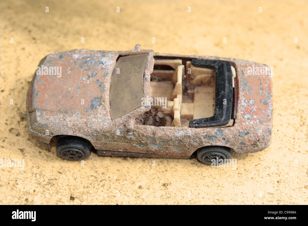 an old rusty toy classic car close up from above Stock Photo - Alamy