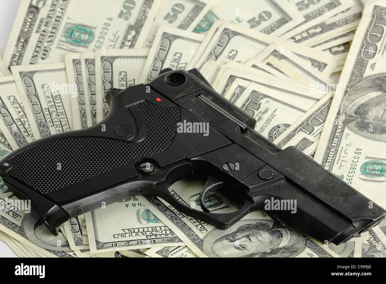 gun and money Stock Photo - Alamy