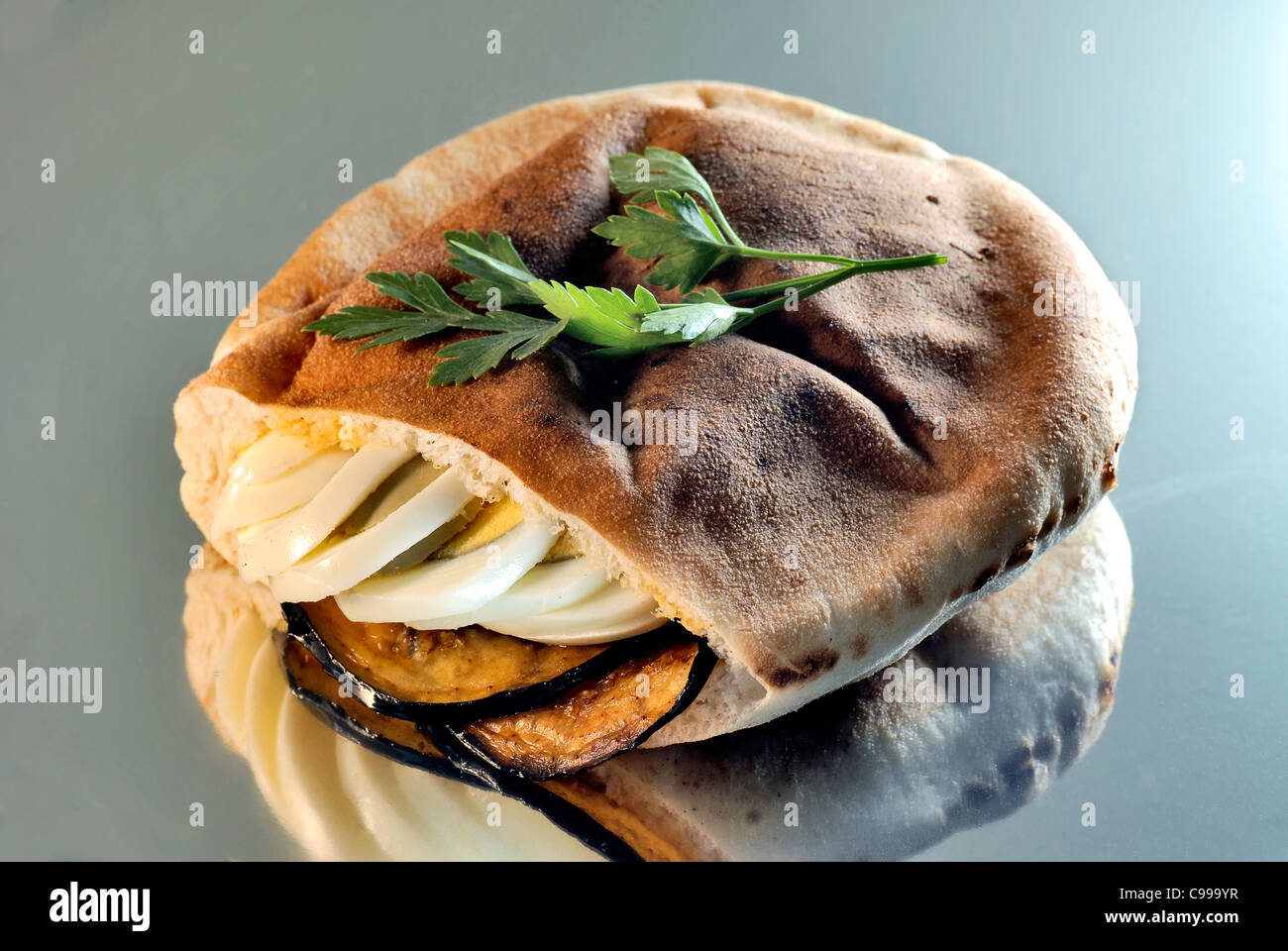 Aubergine and boiled egg in a pita (Sabich) a popular Middle-Eastern ...